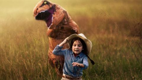 Boy with autism dresses as T.rex for family photos - BBC News
