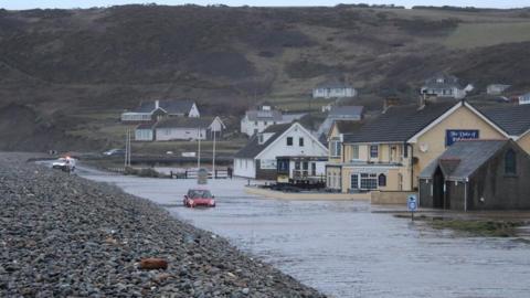 In pictures: Storm Dennis brings flooding to Wales - BBC News
