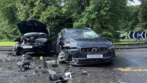 Four injured in crash with unmarked police car and stolen BMW