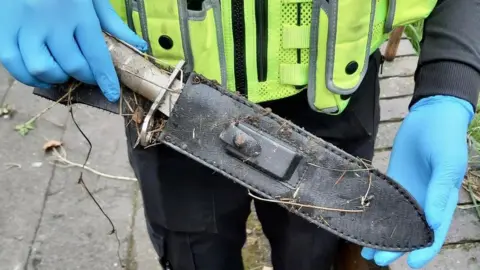 Combat knife and machete found during police searches