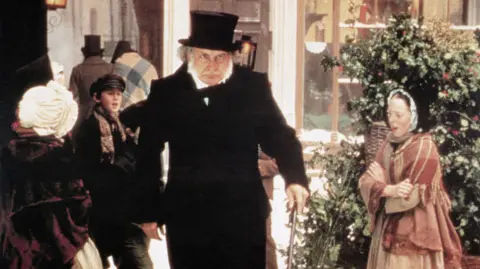 Fictional Scrooge and his real churchyard grave