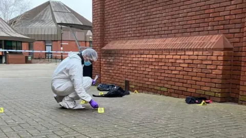 Redditch: Two arrested after man falls from roof