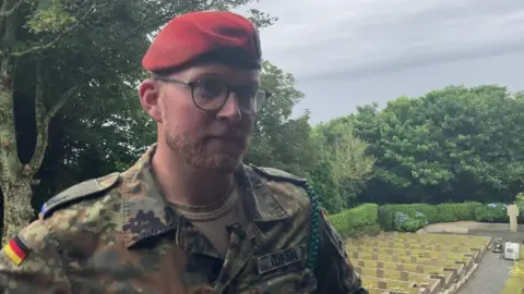 German soldiers carry out work on cemetery
