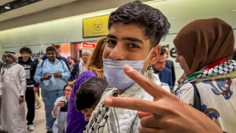 Majd arriving at Heathrow airport
