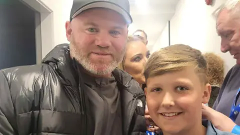 Wayne Rooney: Football star in NI to support son Kai