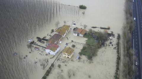 Italy battles floods as bad weather batters Europe - BBC News