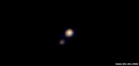 Coloured Pluto comes into view - BBC News