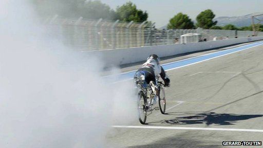 Rocket bicycle sets 207mph speed record - BBC News