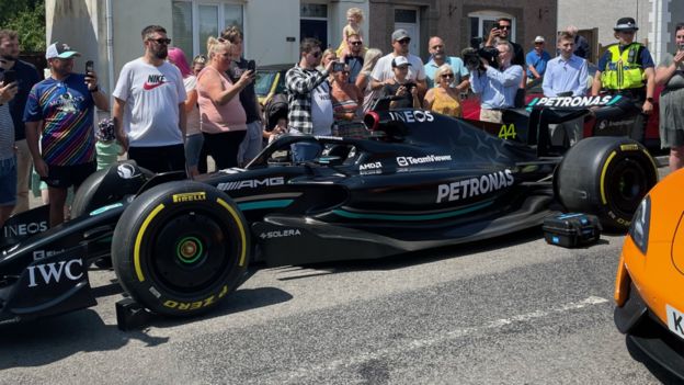 Toddler with terminal cancer gets F1 car and plane surprise - BBC News