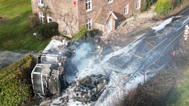 Crawley crash: Cement mixer overturns and catches fire - BBC News