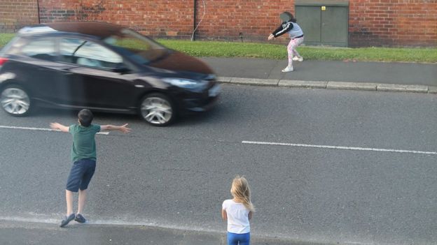 Police release 'unbelievable' child road play photos - BBC News