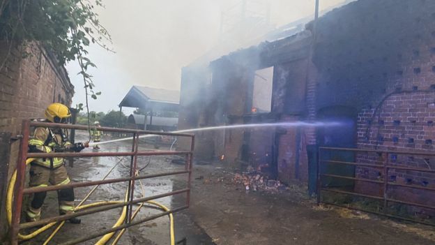 Dozens of firefighters tackle Shropshire barn fire - BBC News