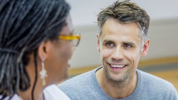 Presenter Richard Bacon 'getting better' after days in coma - BBC News