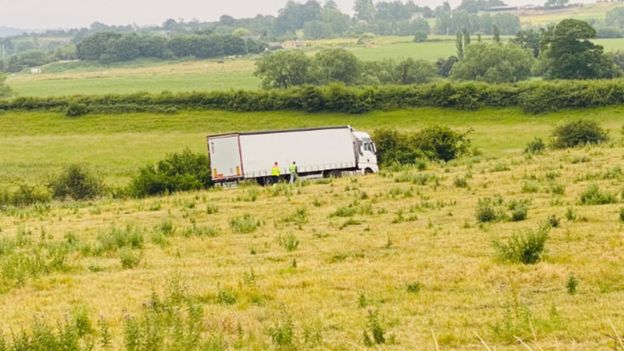 Lorry ends up in field in Wiltshire as driver falls asleep - BBC News