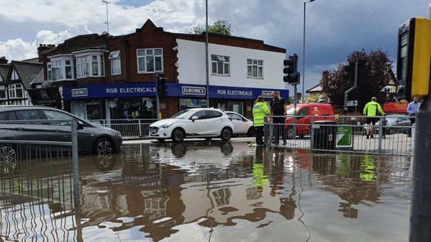 Essex Flooding: Cars stranded and businesses flooded - BBC News