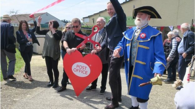 Chardstock post office reopens after £250,000 village buy-out - BBC News