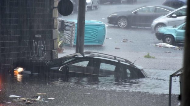 Catania: Two dead as rare storm floods streets of Sicilian city - BBC News