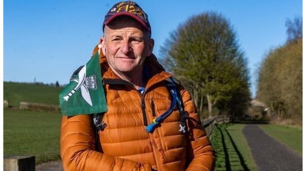 Lighthouse fan completes epic British coast walk for charity - BBC News