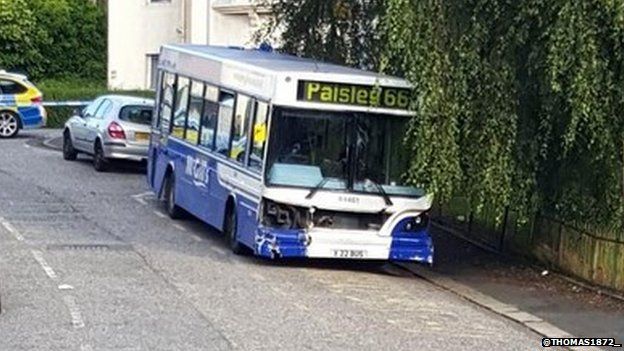 Bus crashes in Paisley after driver falls ill at wheel - BBC News