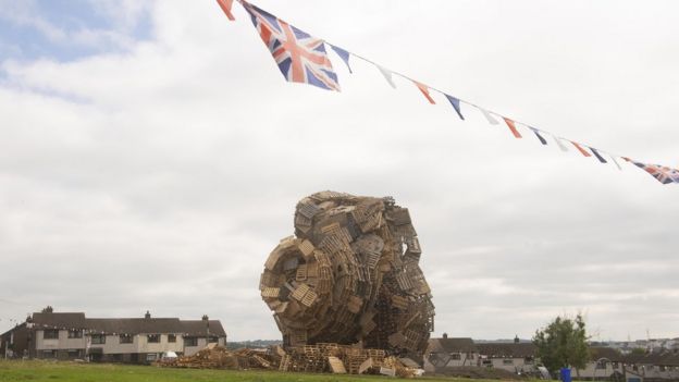 Larne bonfire: Man dies after falling from a height - BBC News
