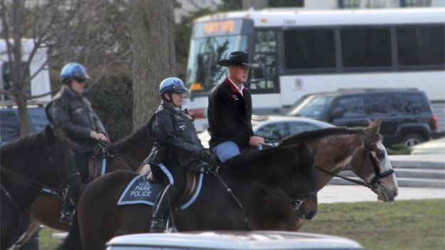 Trump cabinet member trots through Washington on horseback - BBC News