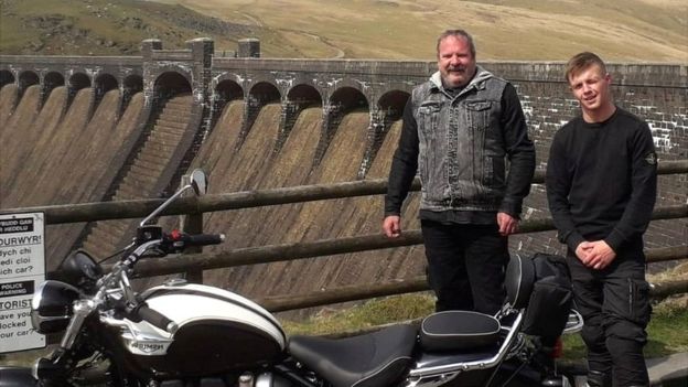 Tribute to biker killed in crash that injured son - BBC News