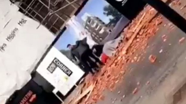 Woman, 28, critical after being 'hit by falling bricks' - BBC News