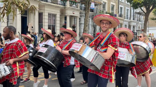 Notting Hill Carnival celebrates Windrush legacy in blaze of colour ...