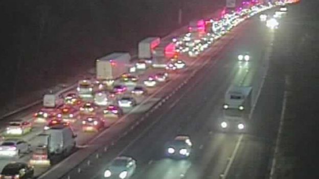 Woman died in M11 car and lorry crash near Harlow, police confirm - BBC News