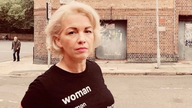 Woman billboard removed after transphobia row - BBC News