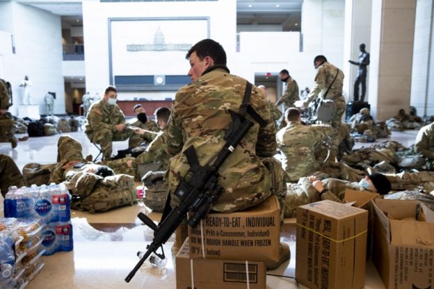 In pictures: Troops guard US Capitol, one week after riots - BBC News