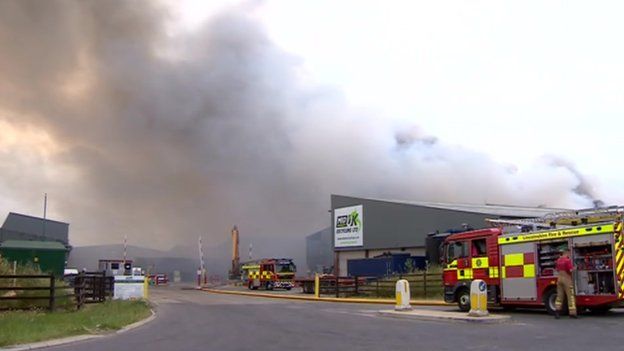 Staff help fire crews with Ancaster recycling fire clean-up - BBC News