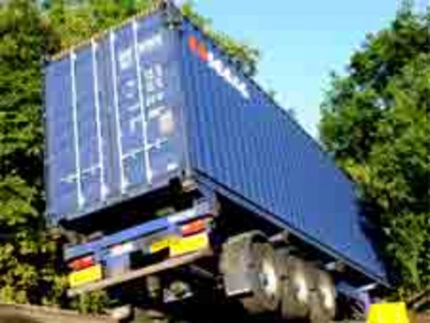 Crash lorry hanging over bridge in Huntingdon - BBC News