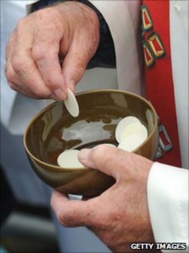 Canadian priest sorry for giving dog Holy Communion - BBC News