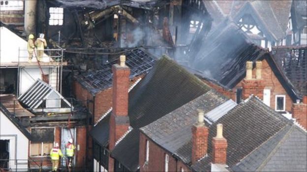 Hereford's fire-damaged shops 'to open in 2012' - BBC News