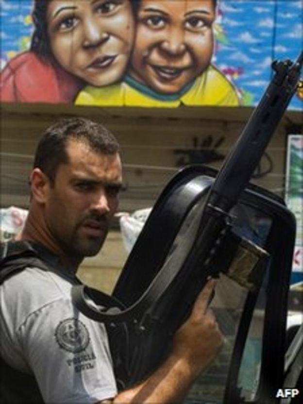 Brazil police battle Rio de Janeiro gang violence - BBC News