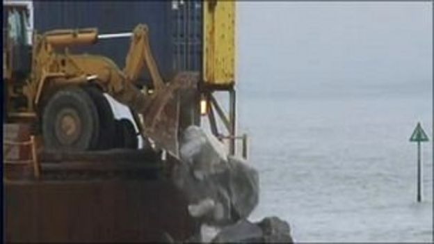 Borth coastal defence rocks unloaded after delay - BBC News