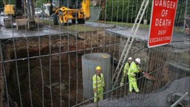 Shrewsbury's historic well collapse road opens - BBC News