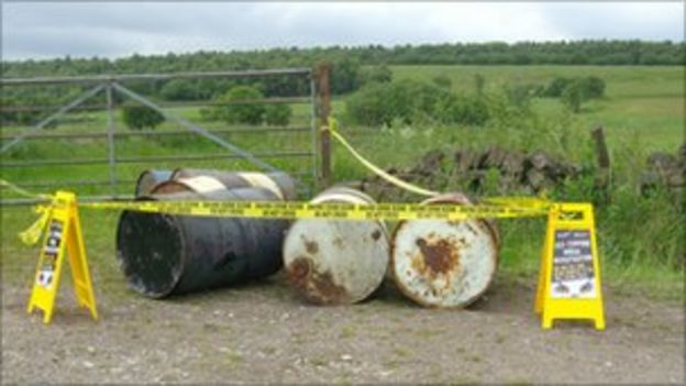 Solvent barrels dumped in road at Uppertown - BBC News