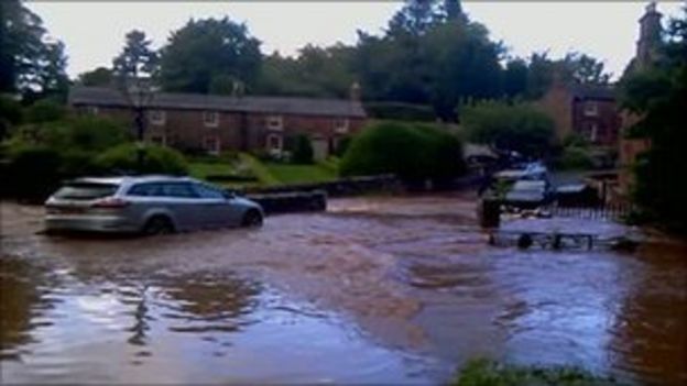 Great Corby bridge collapses in flash floods - BBC News