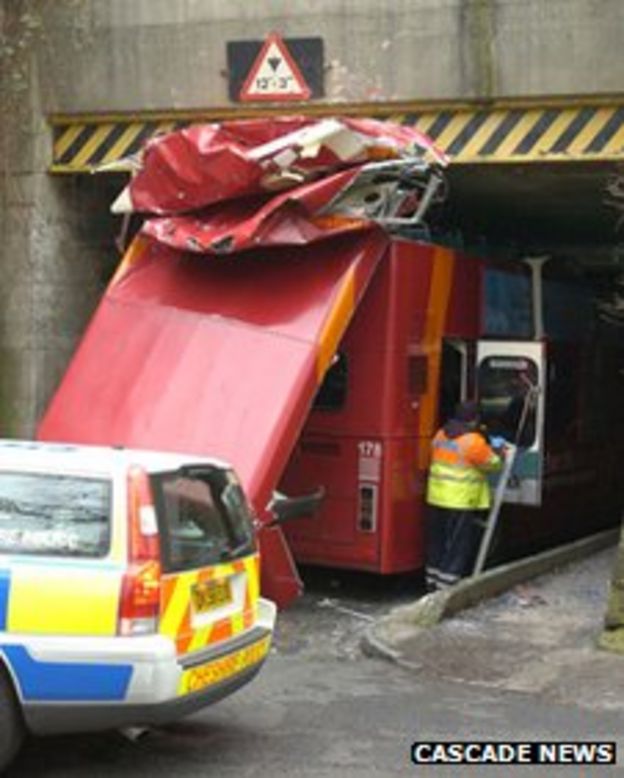 Warrington bus roof ripped off in bridge crash - BBC News