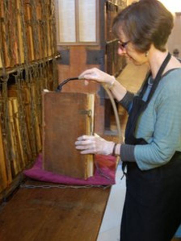 Medieval library with chained books gets annual clean - BBC News