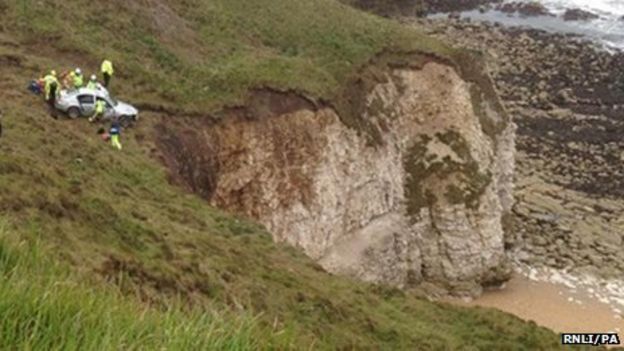Woman rescued from car at East Yorkshire cliff edge - BBC News