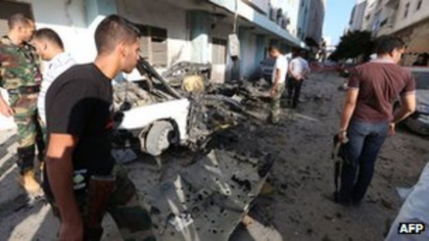 Libya holds 32 'Gaddafi loyalists' over Tripoli attack - BBC News