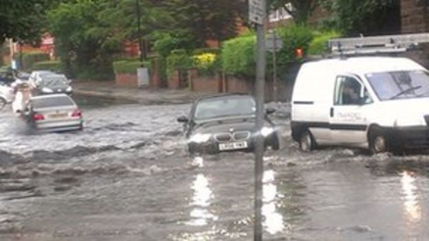Manchester homes flooded due to heavy rain - BBC News