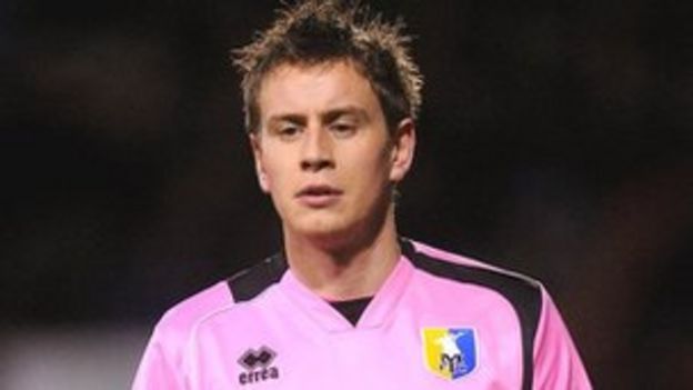 Mansfield Town claim goalkeeper was 'hit by brick' - BBC News