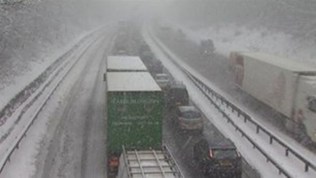 Driver hurt as three lorries crash on snow-hit M74 - BBC News