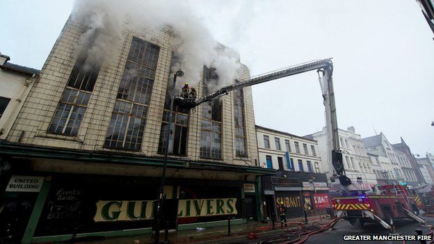 'Demolition' needed at Manchester building fire scene - BBC News