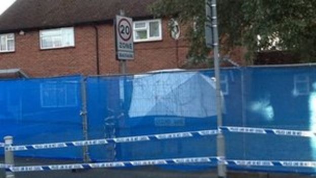 Brothers arrested after body found in Guildford - BBC News