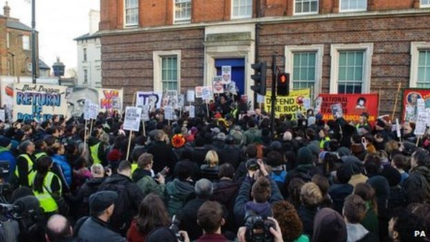 Duggan family vow to continue fight at angry protest - BBC News